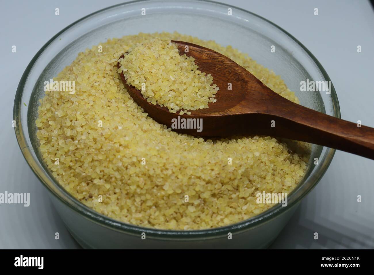 Raw Semolina flour or Rava powder isolated in white background Stock ...
