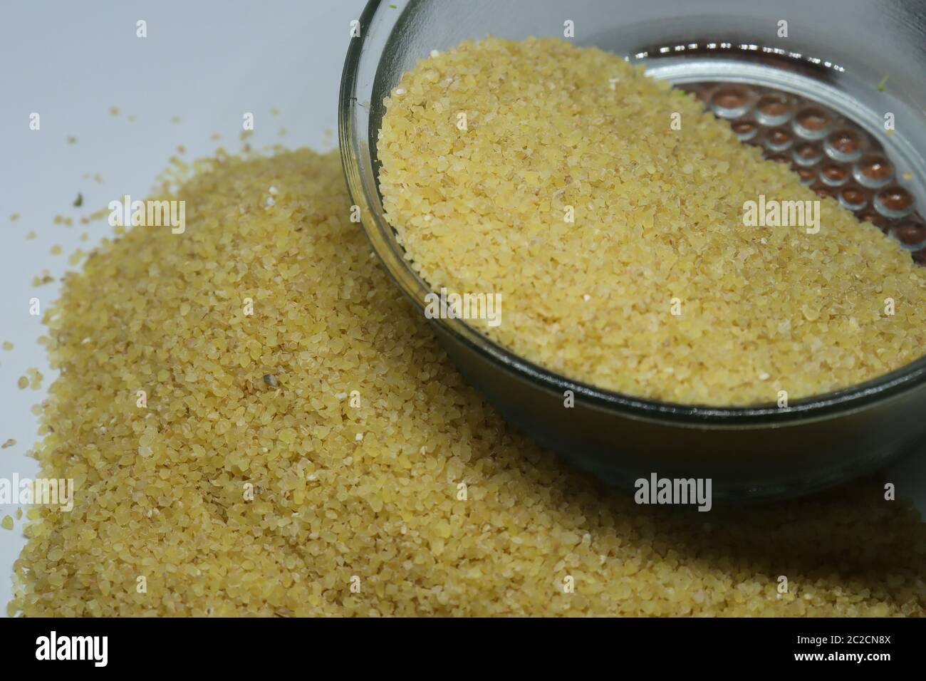 Raw Semolina flour or Rava powder isolated in white background Stock ...