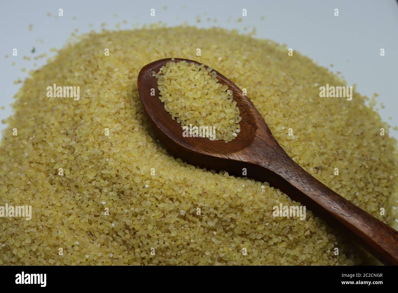 Raw Semolina flour or Rava powder isolated in white background Stock ...