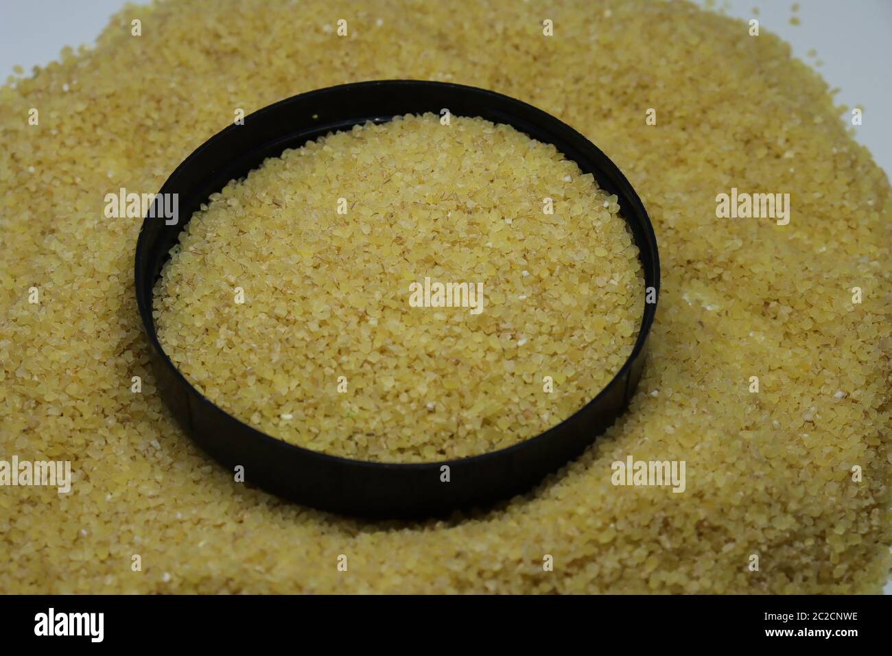 Raw Semolina flour or Rava powder isolated in white background Stock ...