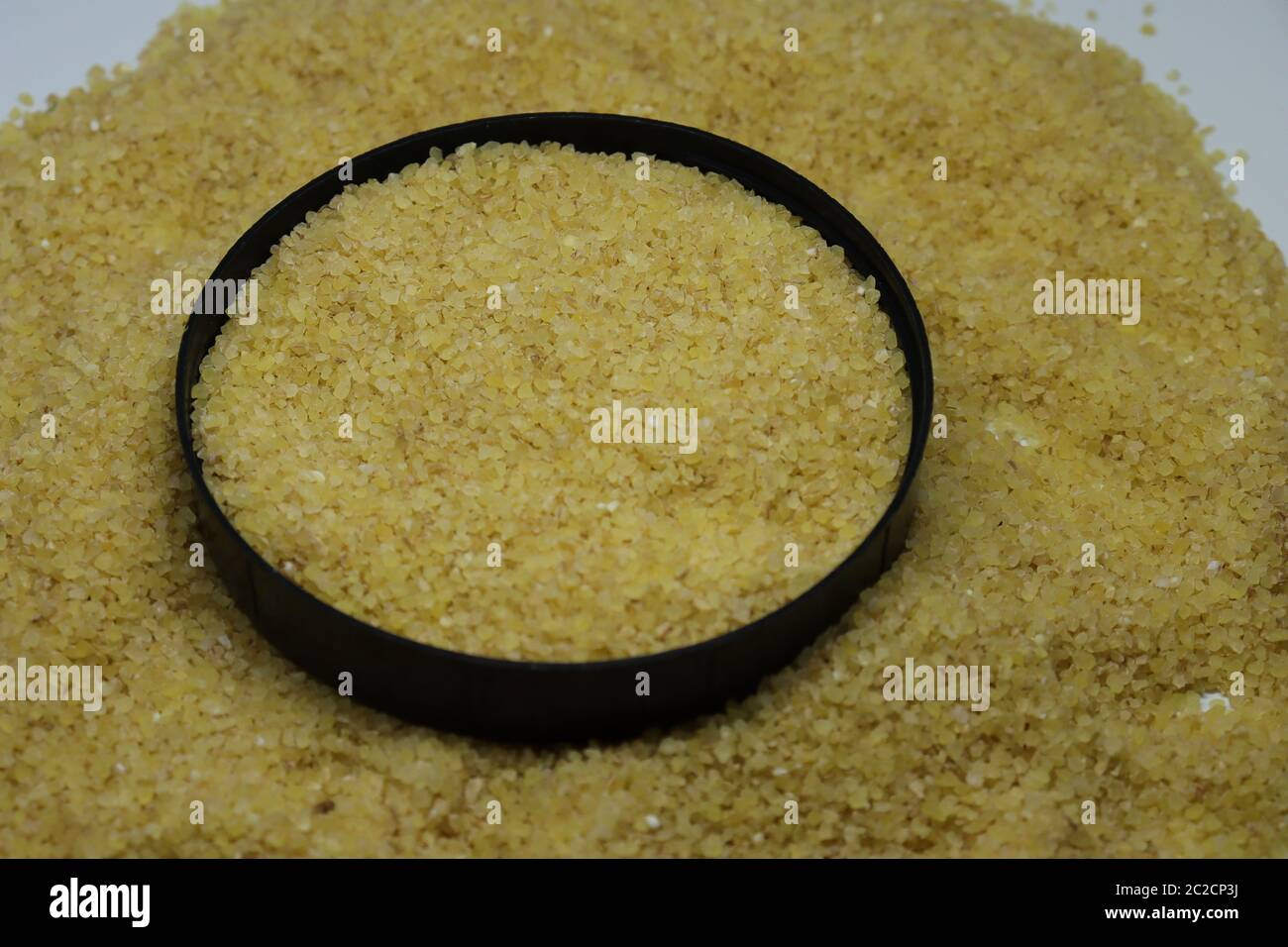 Raw Semolina flour or Rava powder isolated in white background Stock ...
