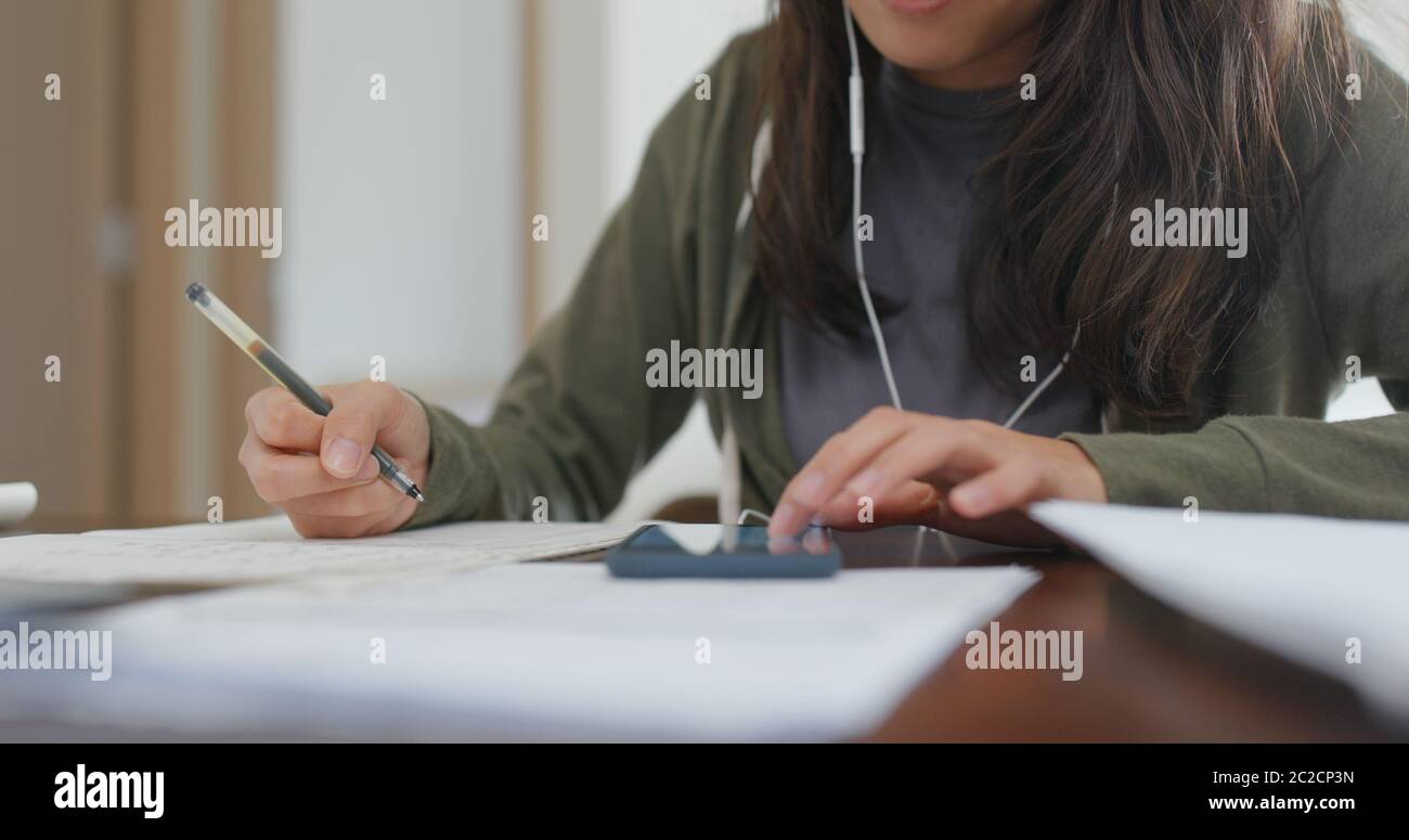 Woman study at home with write on the paper Stock Photo - Alamy