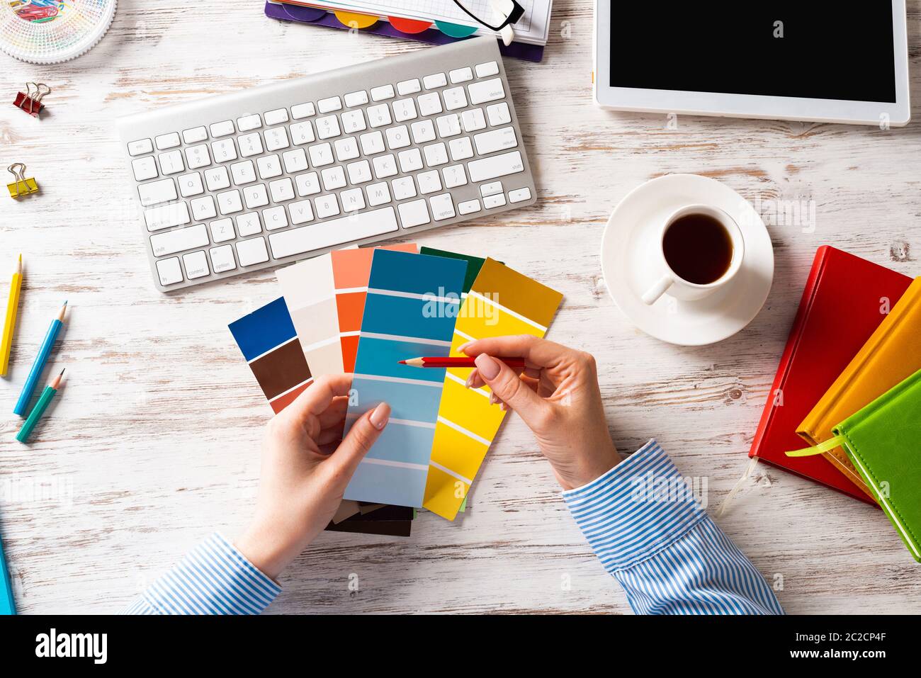 Interior designer choosing colors from swatches Stock Photo - Alamy