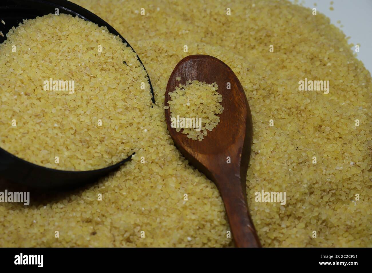 Raw Semolina flour or Rava powder isolated in white background Stock ...