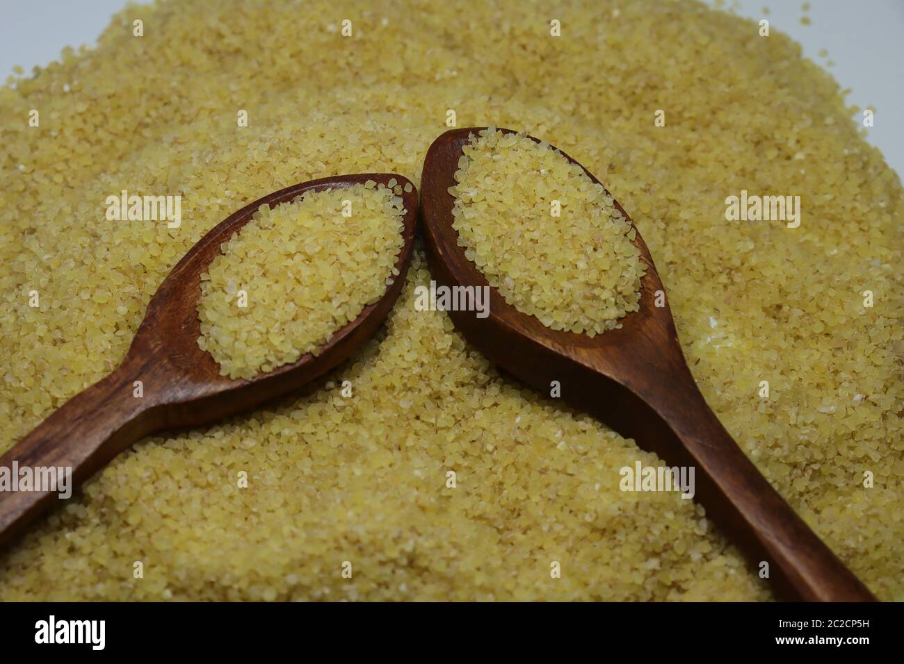 Raw Semolina flour or Rava powder isolated in white background Stock ...