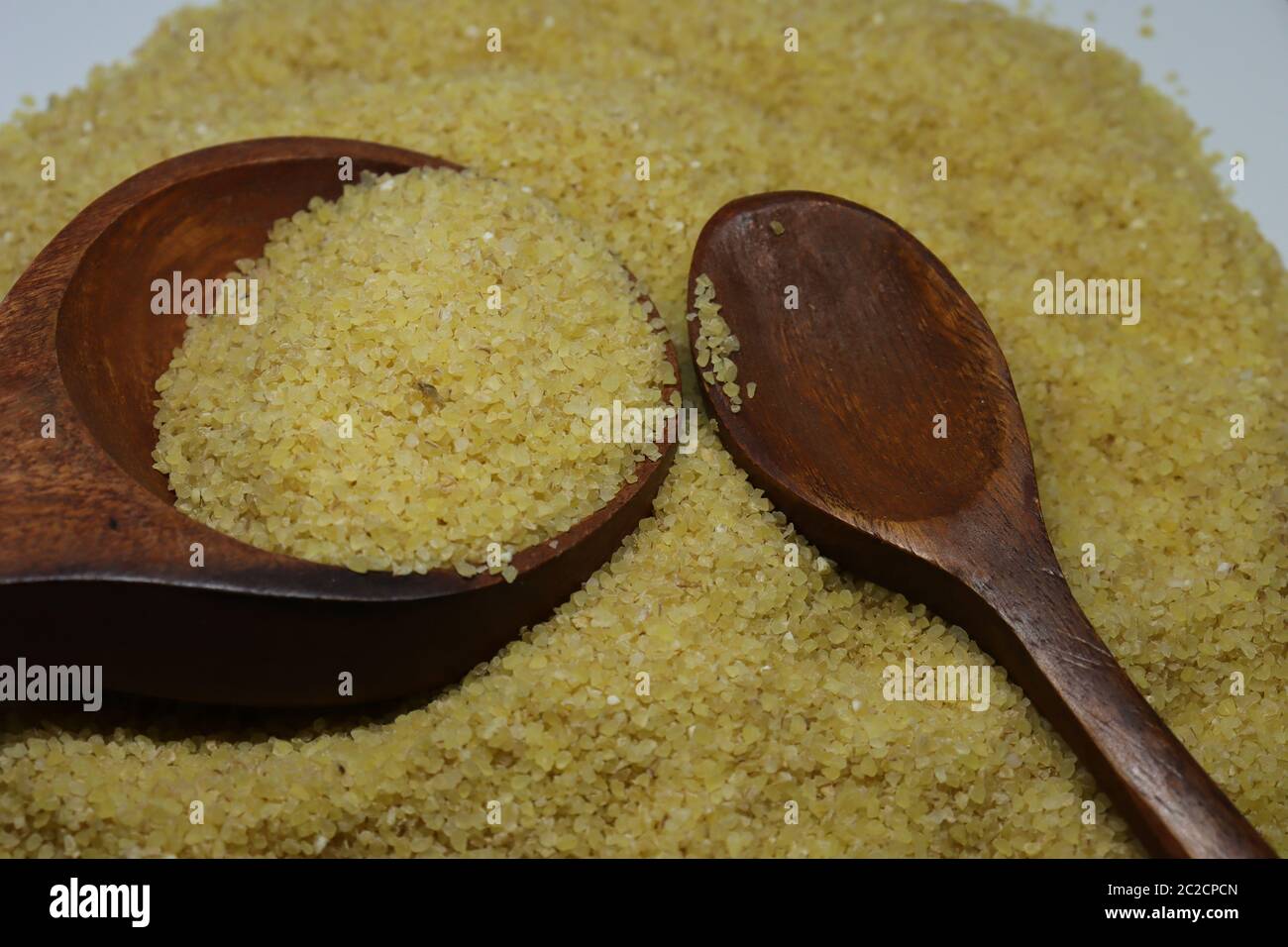 Raw Semolina flour or Rava powder isolated in white background Stock ...