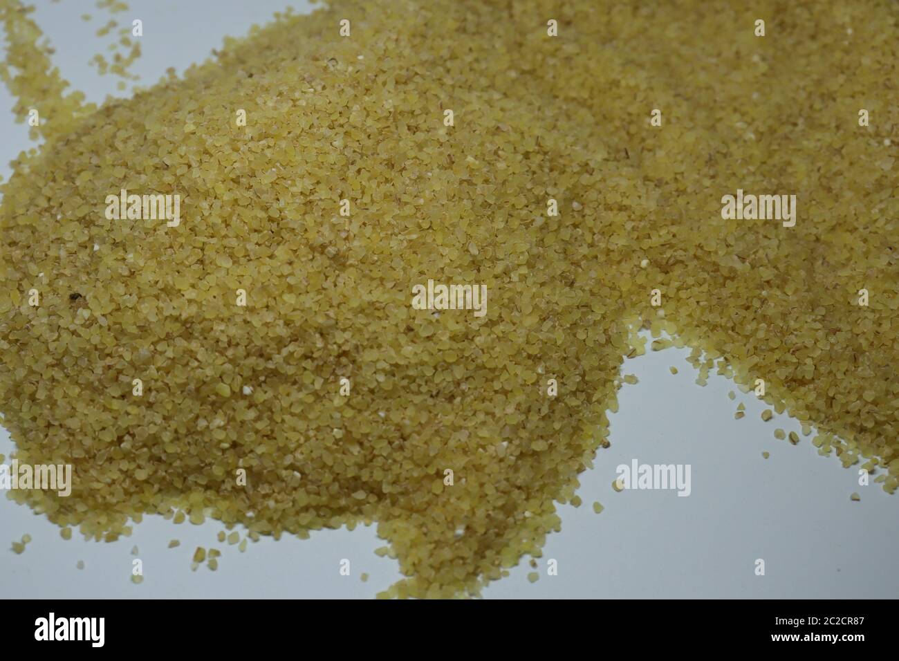 Raw Semolina flour or Rava powder isolated in white background Stock ...