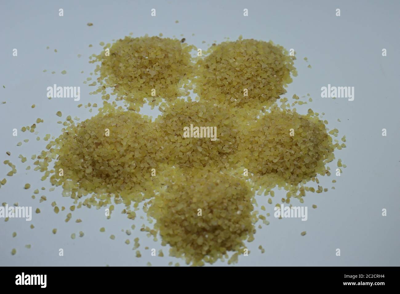 Raw Semolina flour or Rava powder isolated in white background Stock ...