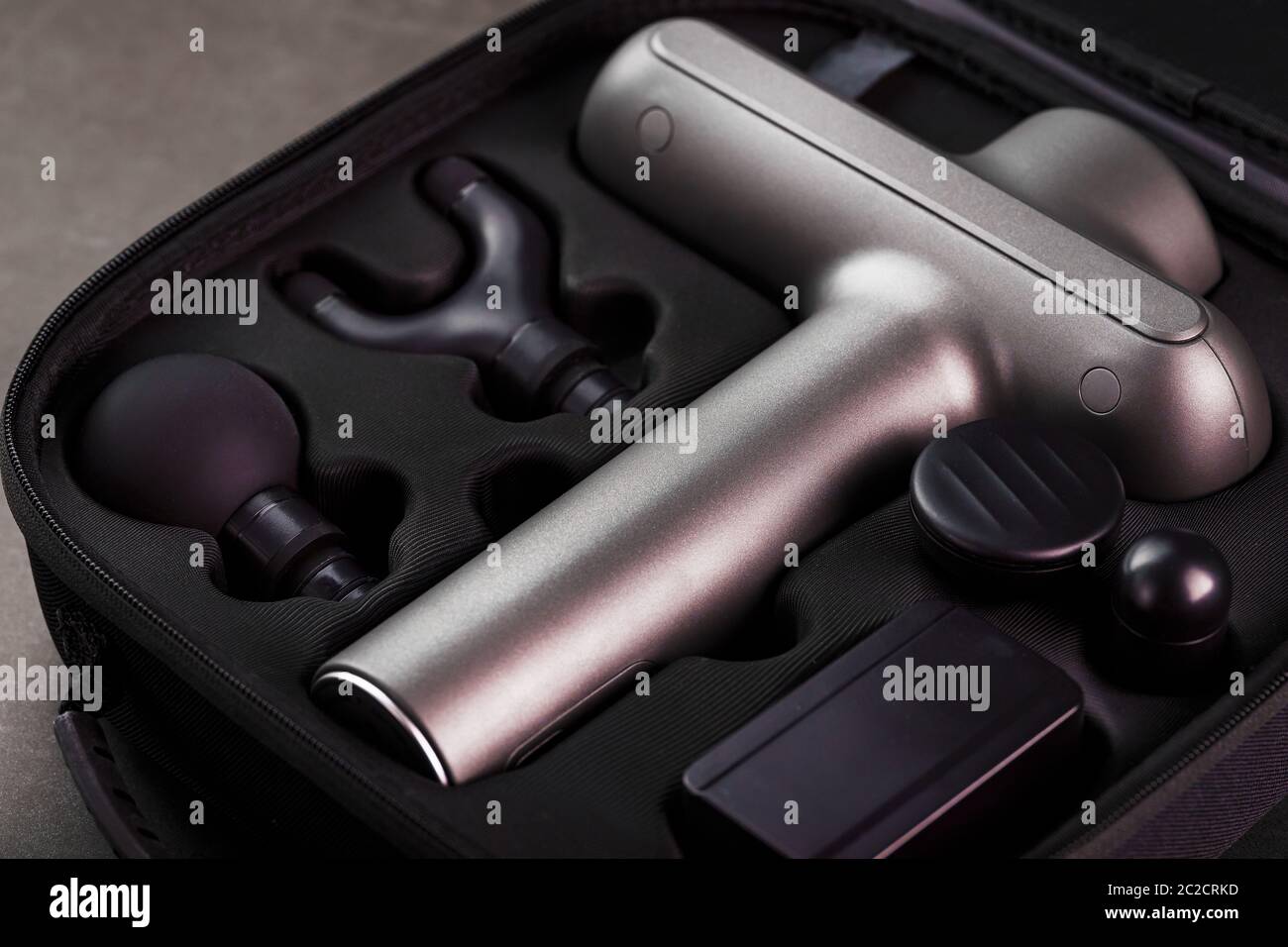 Electric massager Machine for body massage in a case on a black ...