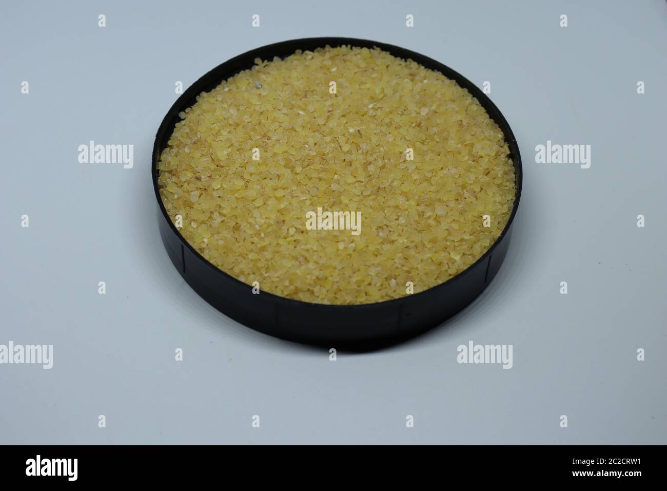 Raw Semolina flour or Rava powder isolated in white background Stock ...