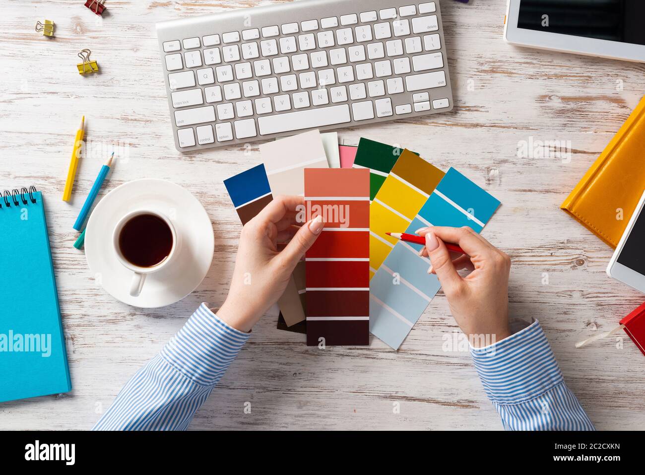 Web designer choosing colors from swatches Stock Photo - Alamy