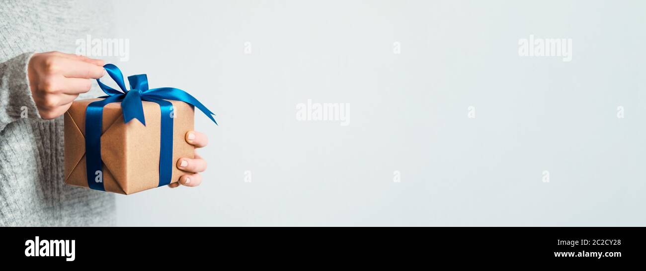 Female hands opening gift box, copy space right Stock Photo - Alamy