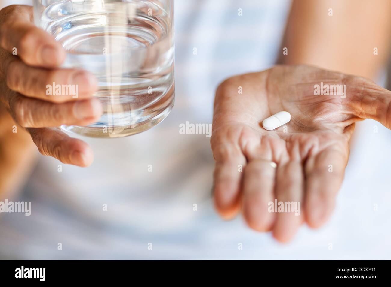 Senior woman taking her daily prescripted medication Stock Photo - Alamy