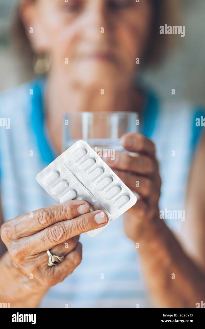 Sick woman dosage pills daily hi-res stock photography and images - Alamy