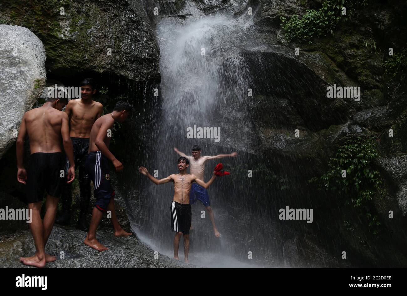 Kathmandu, Nepal. 17th June, 2020. Nepali people have fun in waterfall ...