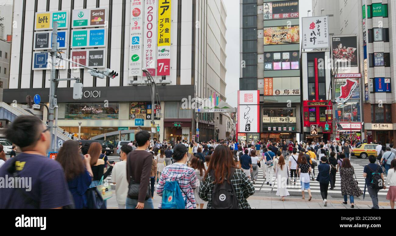 Tokyo, Japan, 25 June 2019: People cross the road in Ueno city street ...
