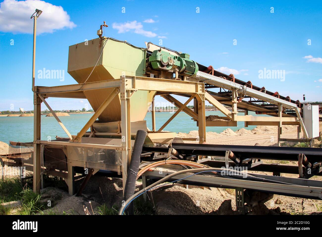 A string of transport belting in a gravel pit for transporting gravel ...