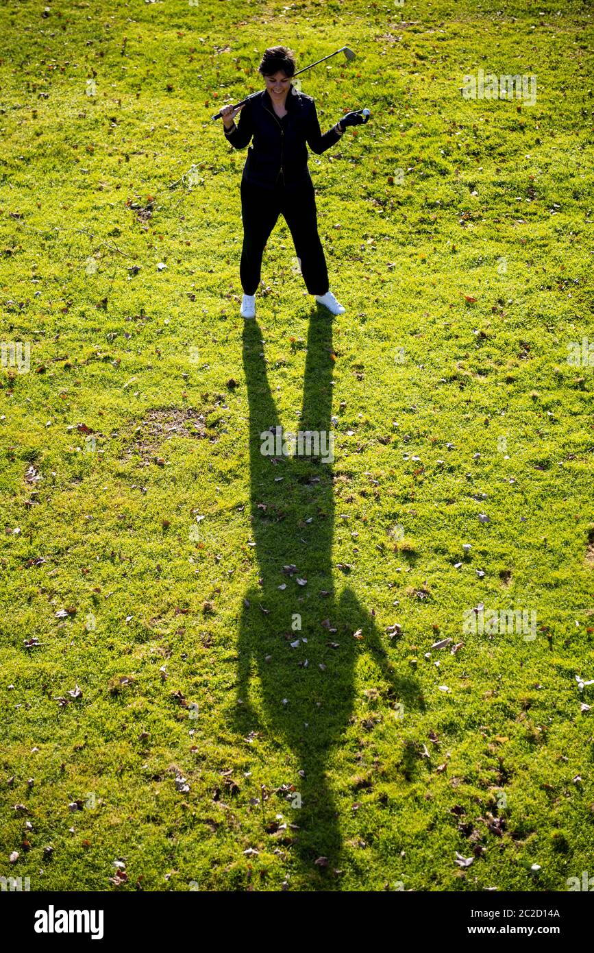 Aerial View of a Golfer Holding Golf Club and Ball and Standing on the ...