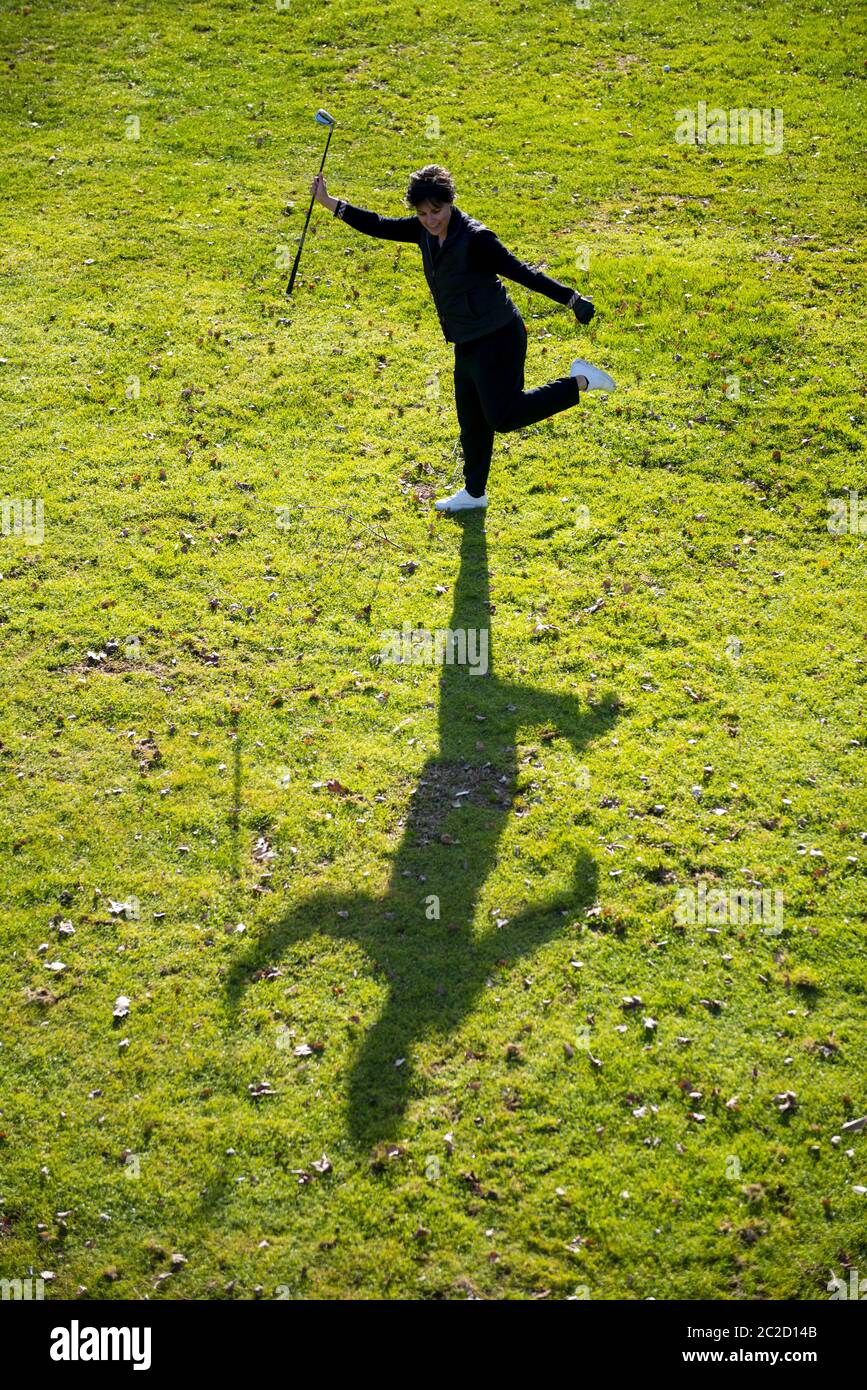 Aerial View of a Golfer with Success Holding Golf Club and Ball and ...