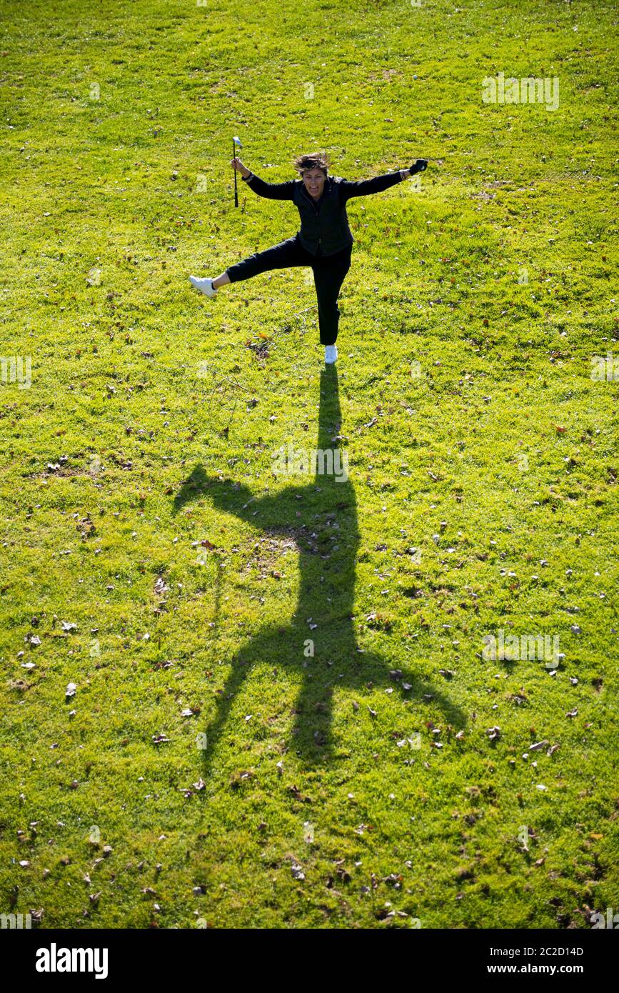 Aerial View of a Golfer with Success Holding Golf Club and Ball and ...
