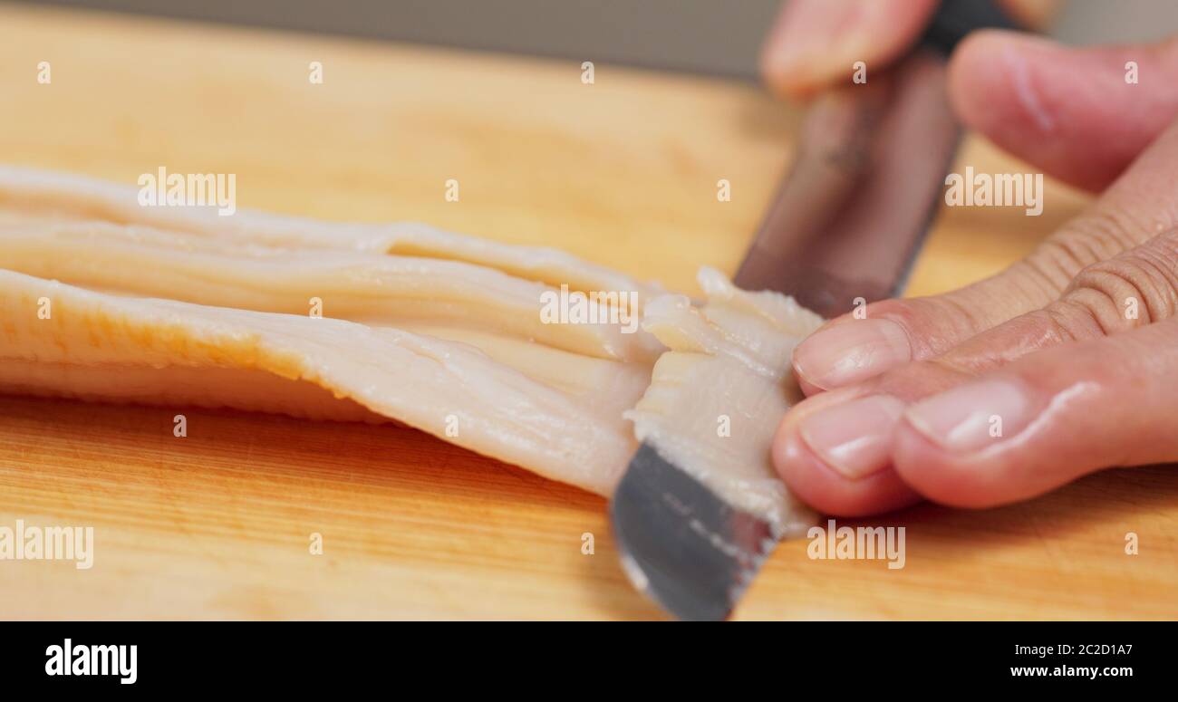 Cutting Fresh Geoduck on wooden board Stock Photo - Alamy