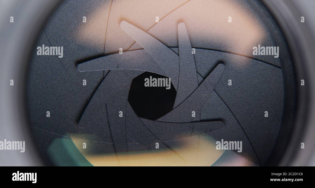 Adjusting aperture on camera lens Stock Photo - Alamy