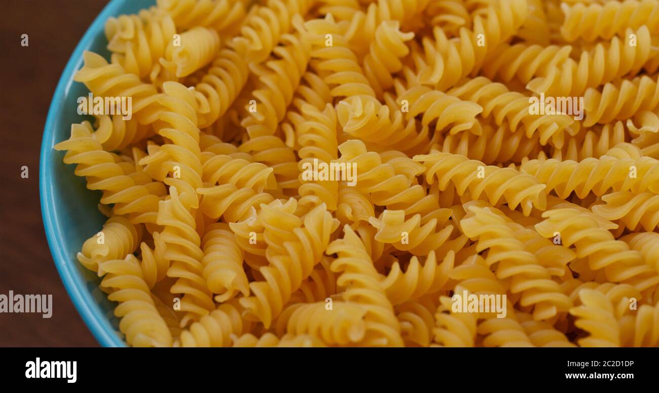 Stack of fusilli on plate Stock Photo - Alamy