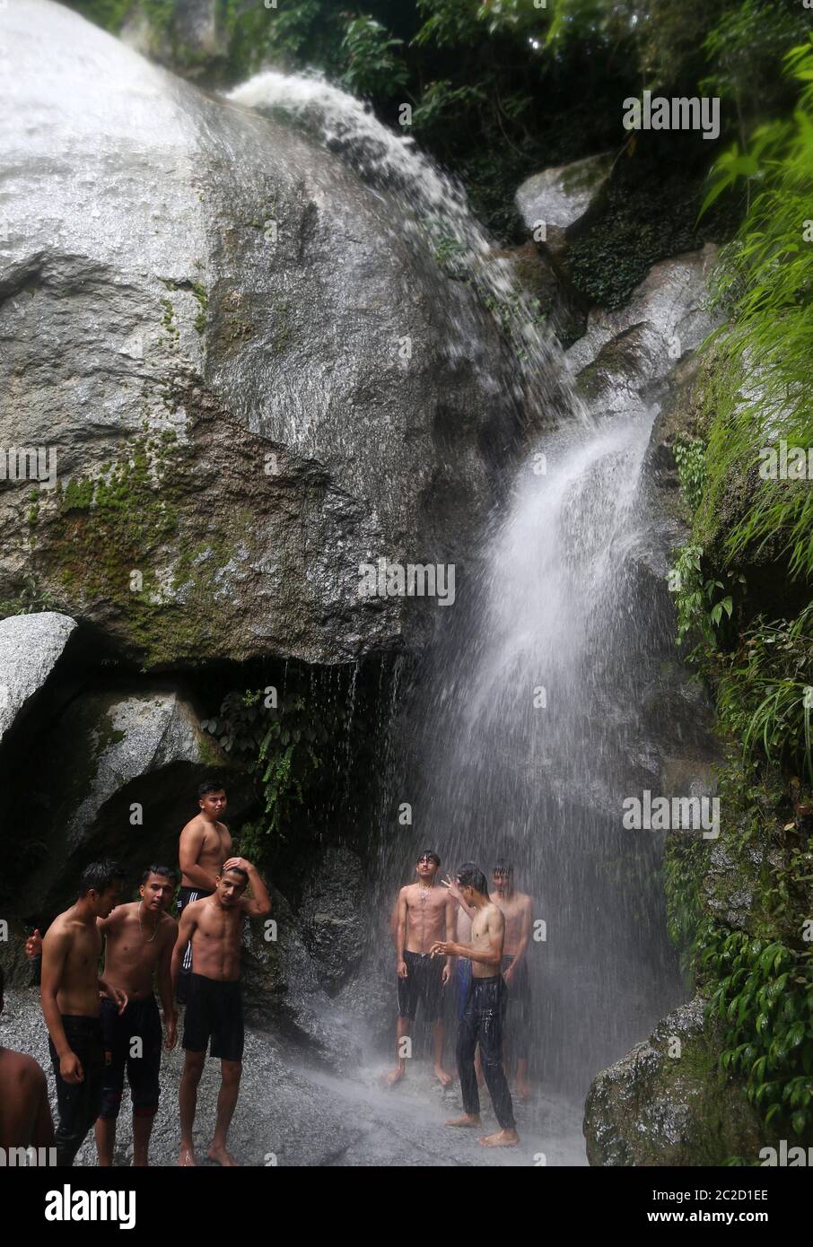 Kathmandu, Nepal. 17th June, 2020. Nepali people have fun in waterfall ...