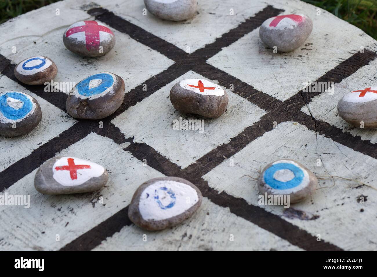 Wood and stone outdoor game of noughts and crosses or tic tac toe Stock ...