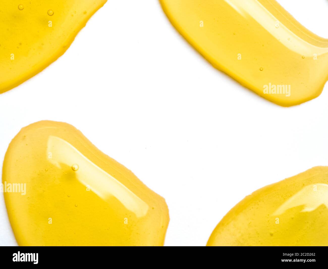 Honey drops abstract pattern, isolated on white Stock Photo - Alamy