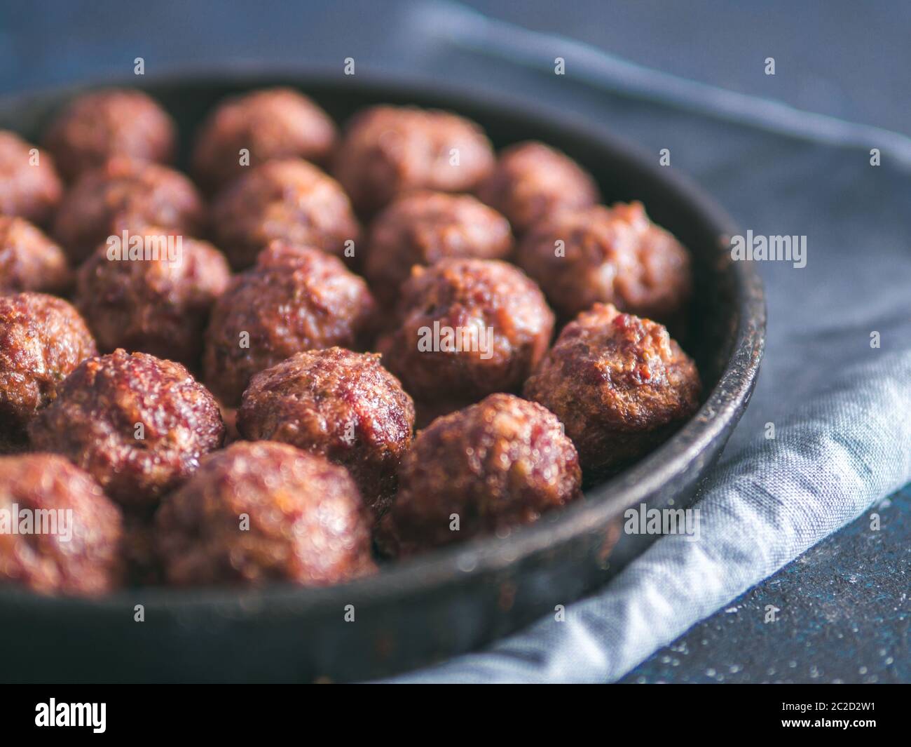 Homemade beef meatballs in cast-iron skillet Stock Photo - Alamy