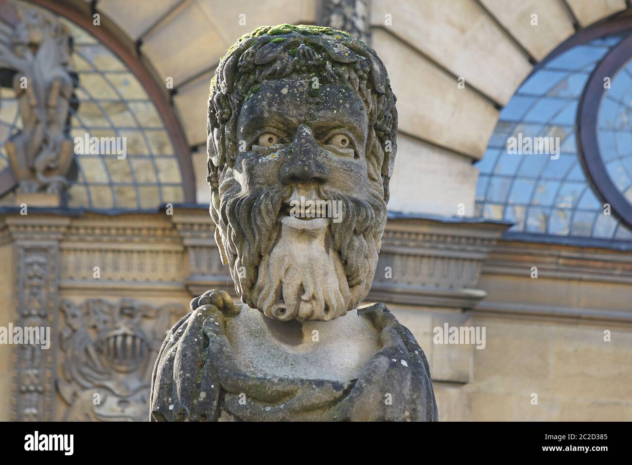 One of 17 different carved heads outside the Sheldonian Theatre and ...