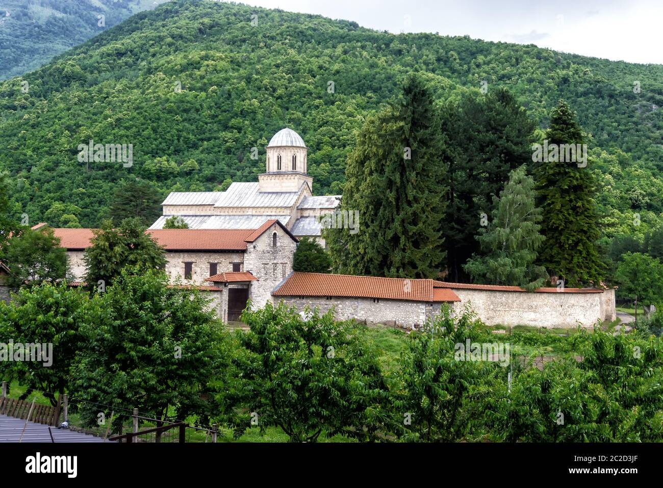 Landscape of Monastery Visoki Decani surrounded by mountains in Kosovo ...