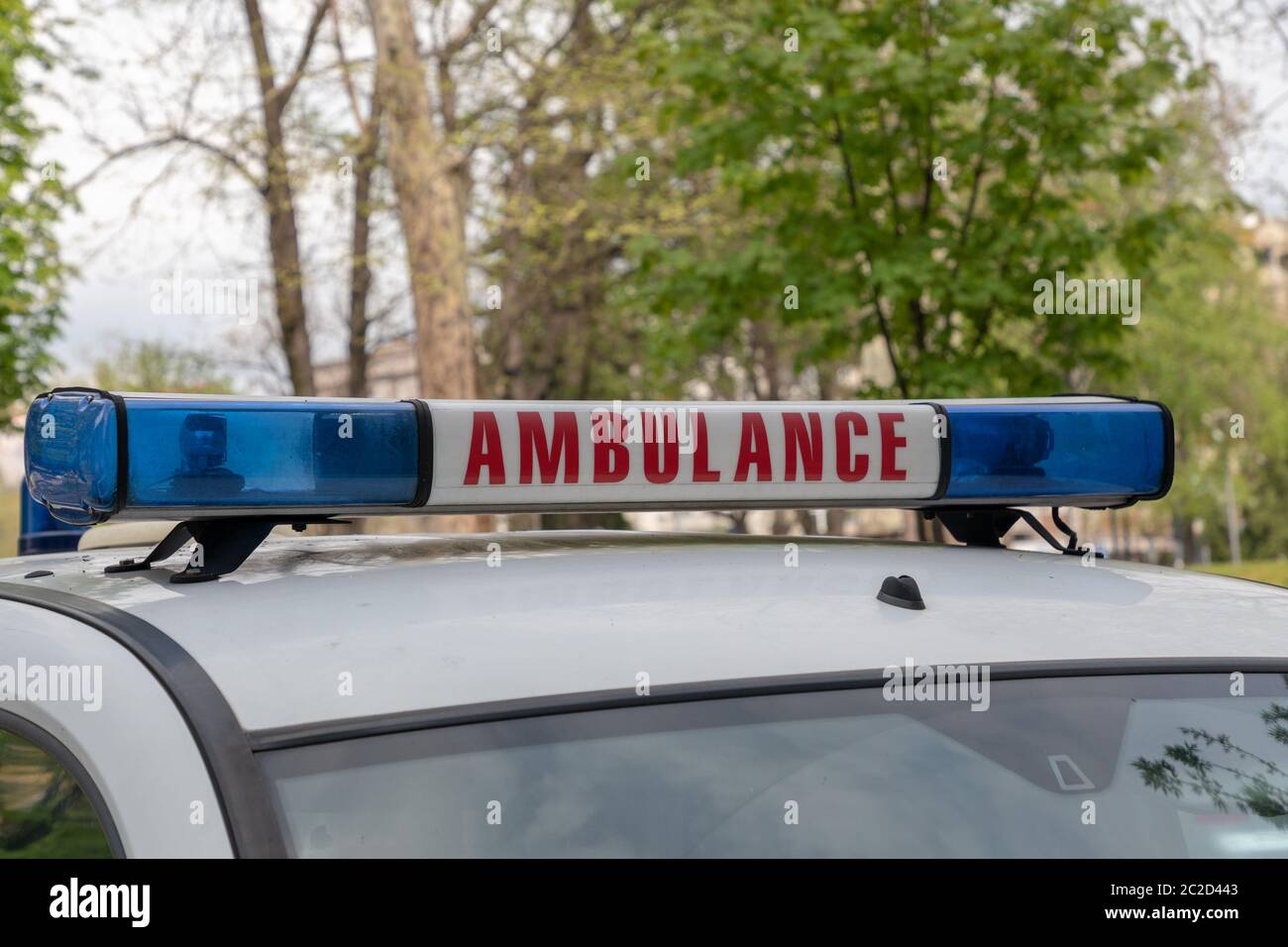 Ambulance Sign With Blue Lights Bar and Siren Stock Photo - Alamy
