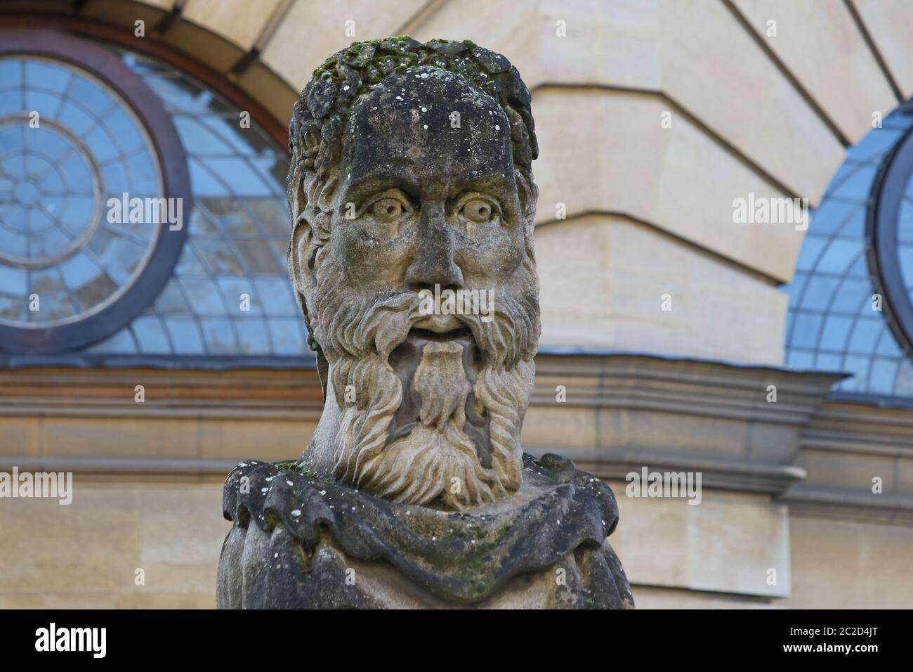 One of 17 different carved heads outside the Sheldonian Theatre and ...