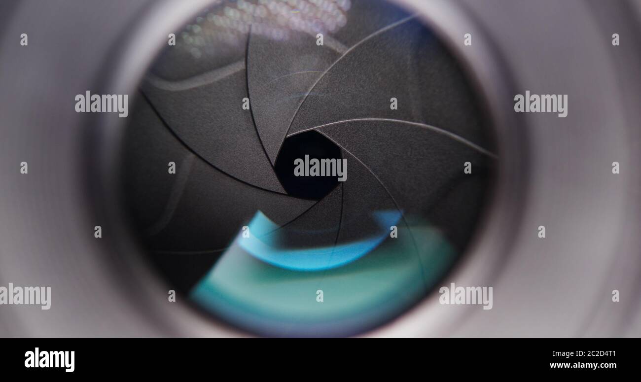 Adjusting aperture on camera lens Stock Photo - Alamy