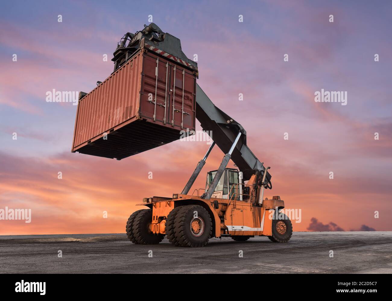 Forklift handling container box loading at the Docks with Truck Stock ...