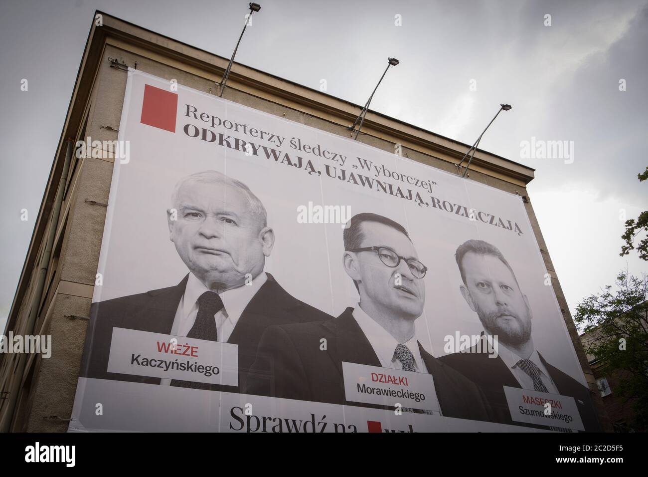 A large banner advertising investigations revealing financial scandals ...