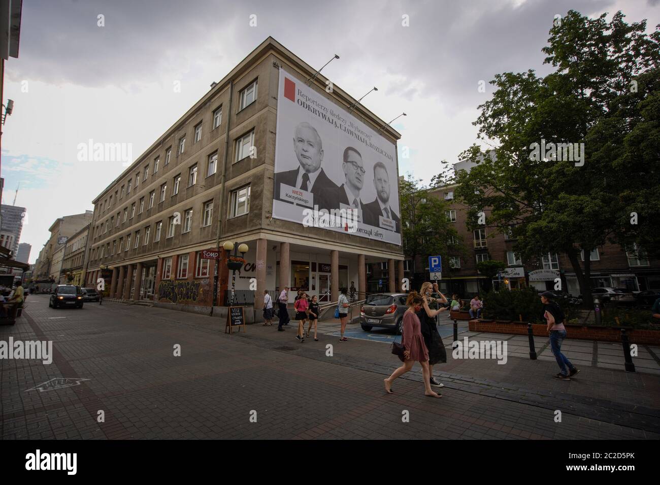 A large banner advertising investigations revealing financial scandals ...