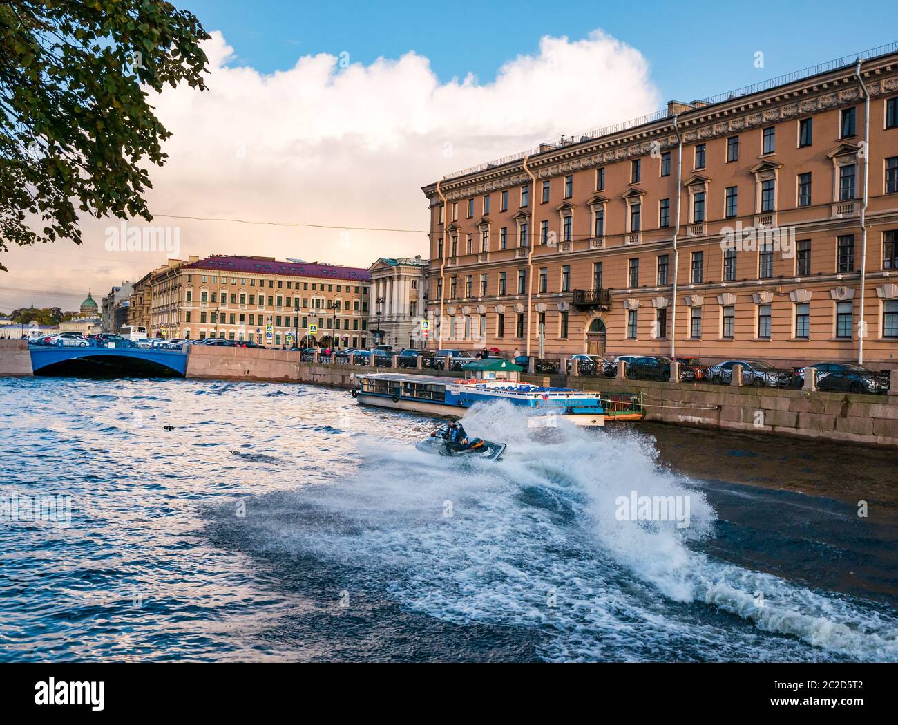 Jet skier in canal creating wave near Blue Bridge, Moyka River ...