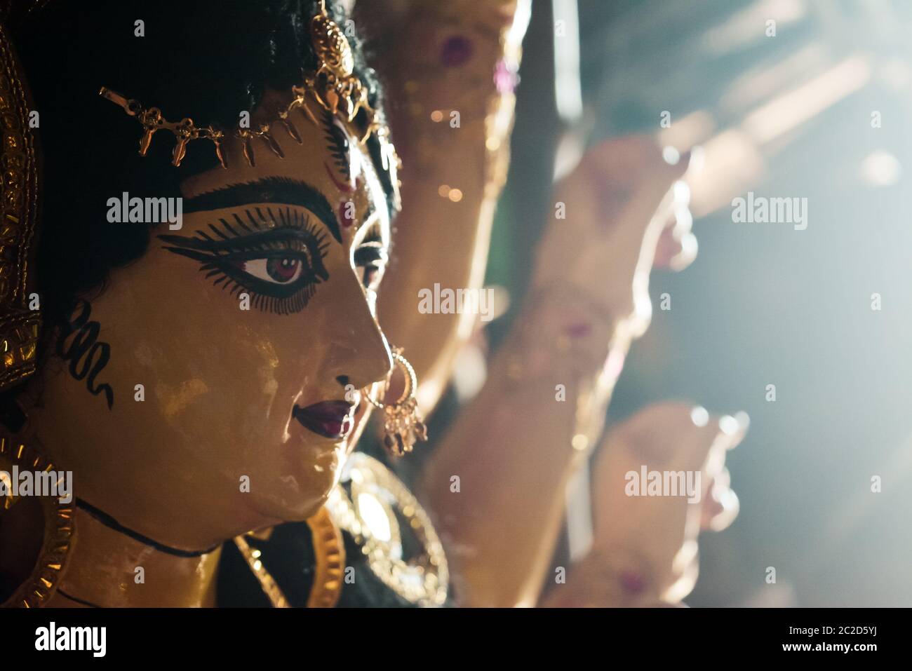 Close up side view face of Goddess Maa Durga Idol. A symbol of strength ...