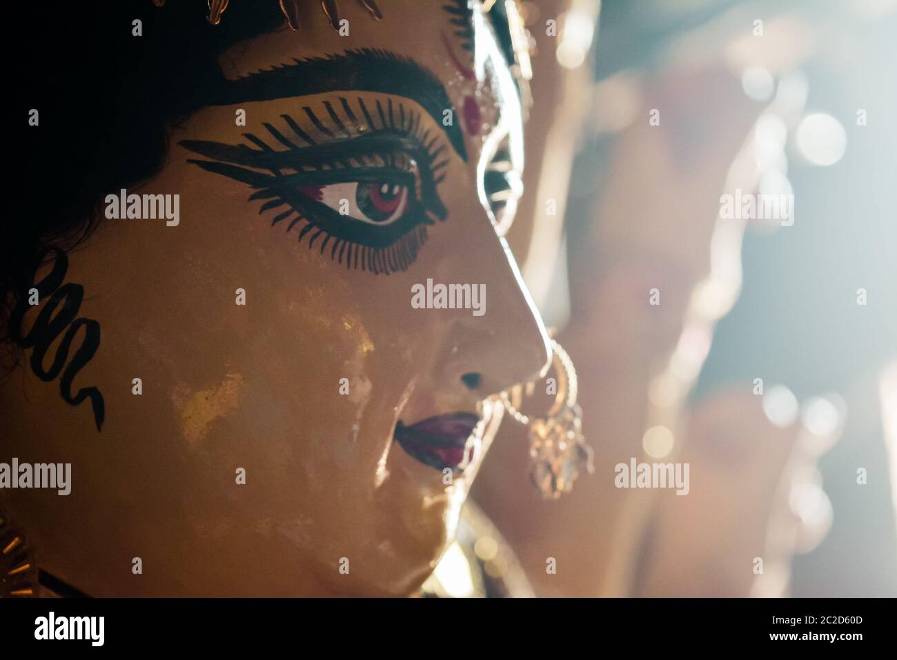 Close up side view face of Goddess Maa Durga Idol. A symbol of strength ...