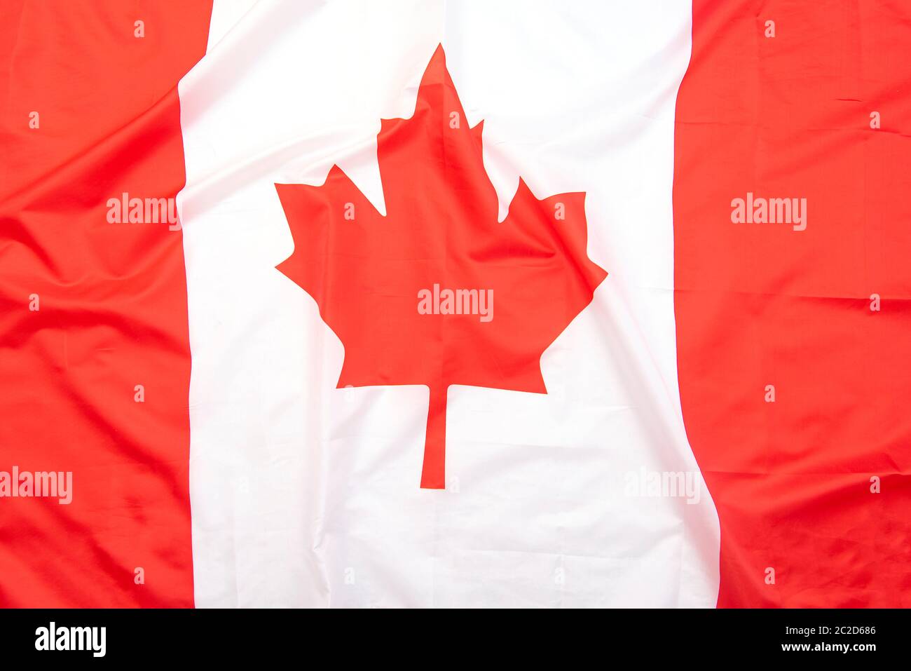 Real fabric flag of Canada as background or texture, top view, Canadian ...
