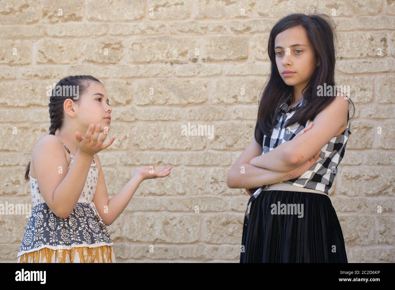 Two girls who have fallen out being upset with each other Stock Photo ...