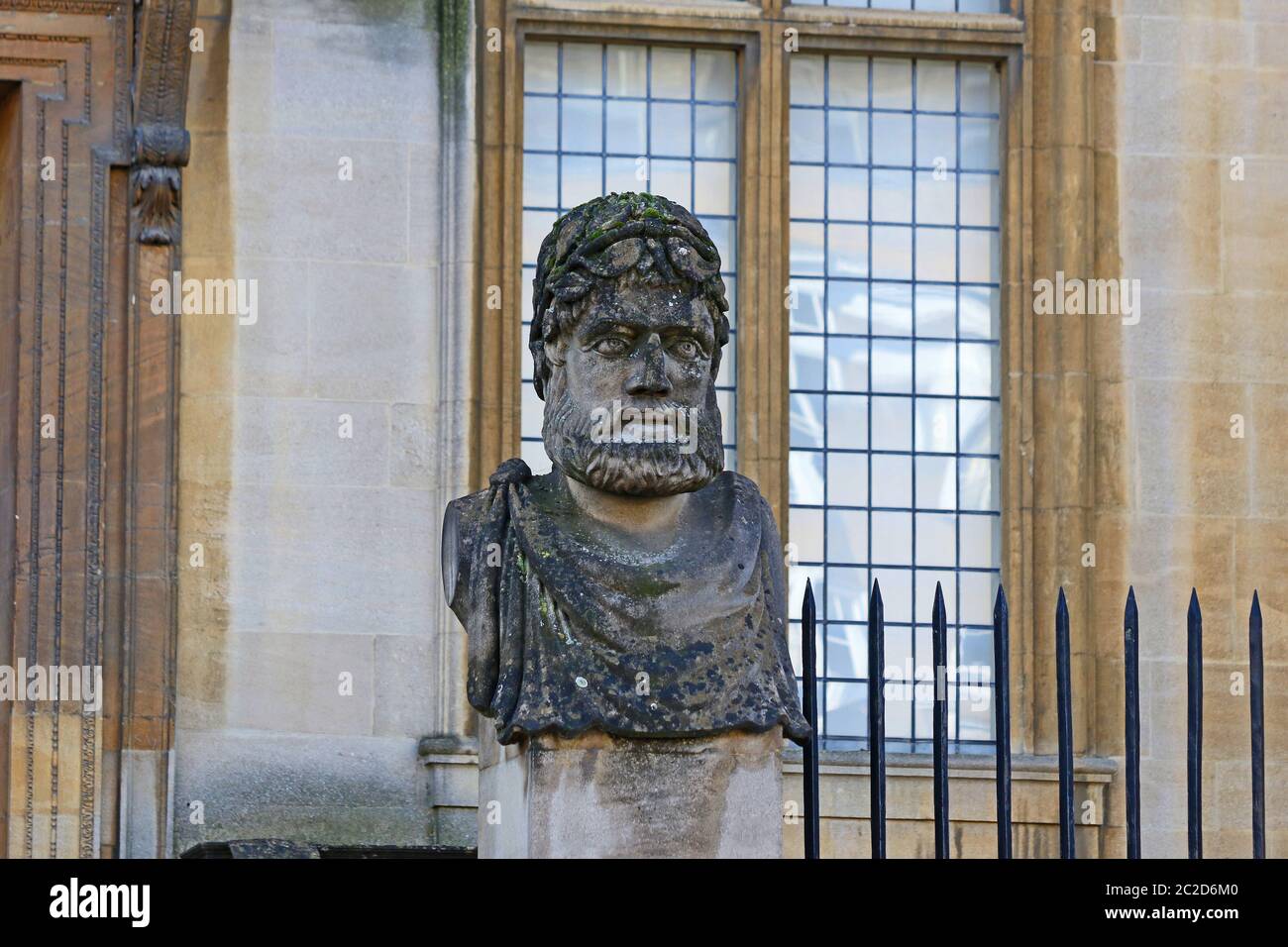 One of 17 different carved heads outside the Sheldonian Theatre and ...