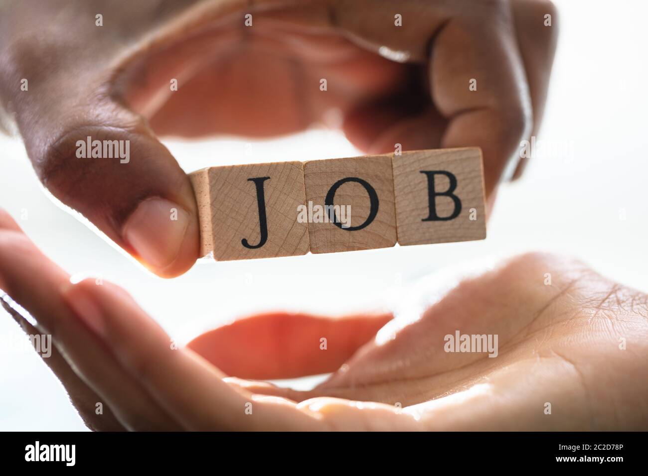 Businessperson Giving Wooden Block With Job Text To Candidate Stock ...