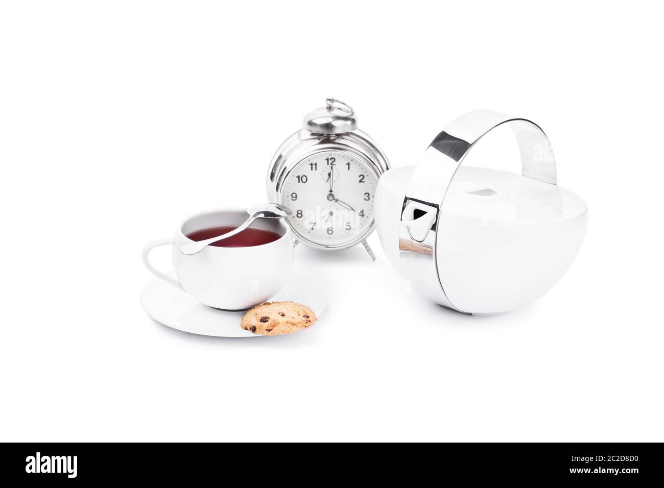 Cup of tea with chocolate cookies and an alarm clock,isolated on white ...