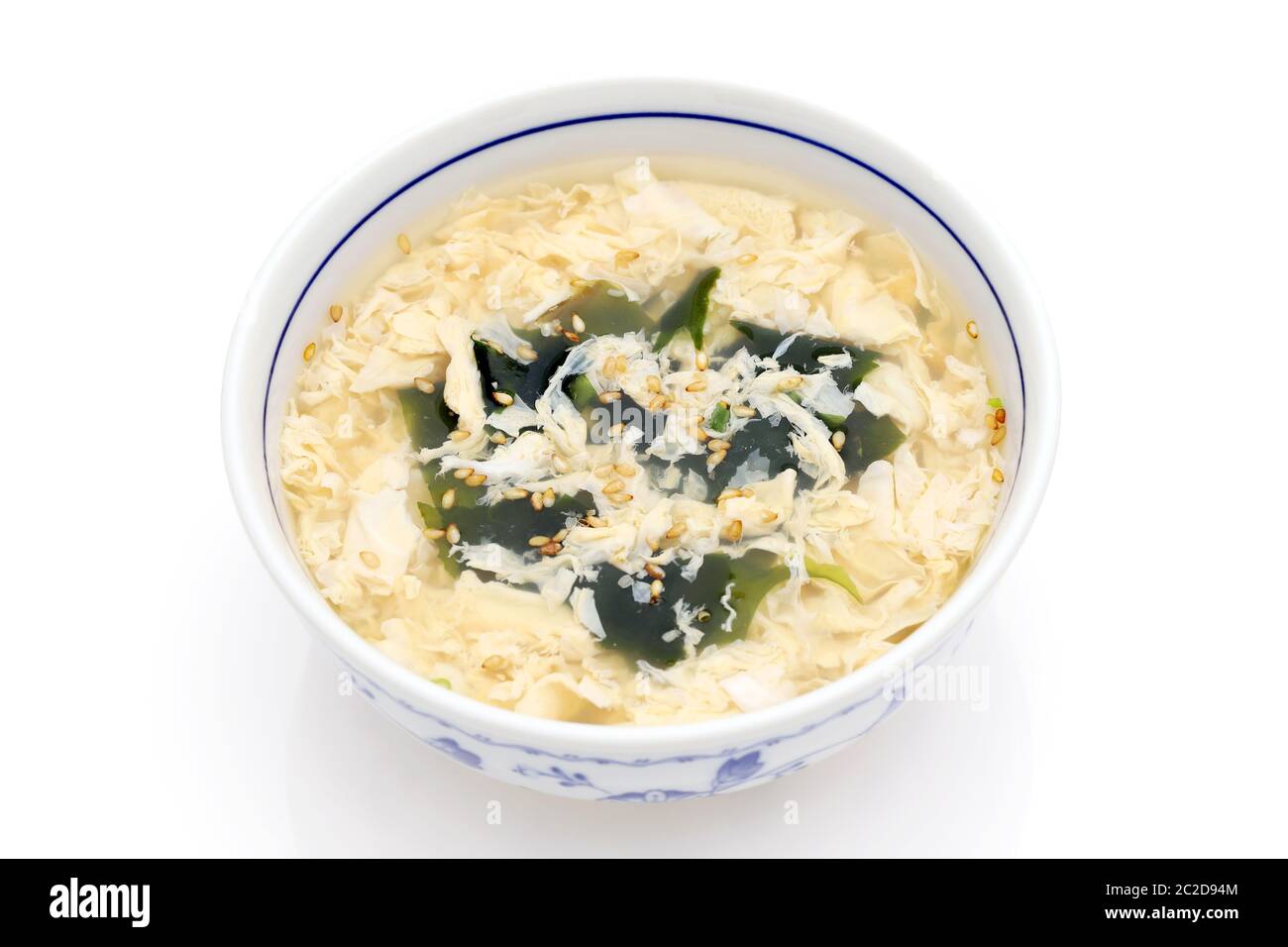 Japanese foof, Tamago egg soup in a wooden bowl on white backgroundã ...