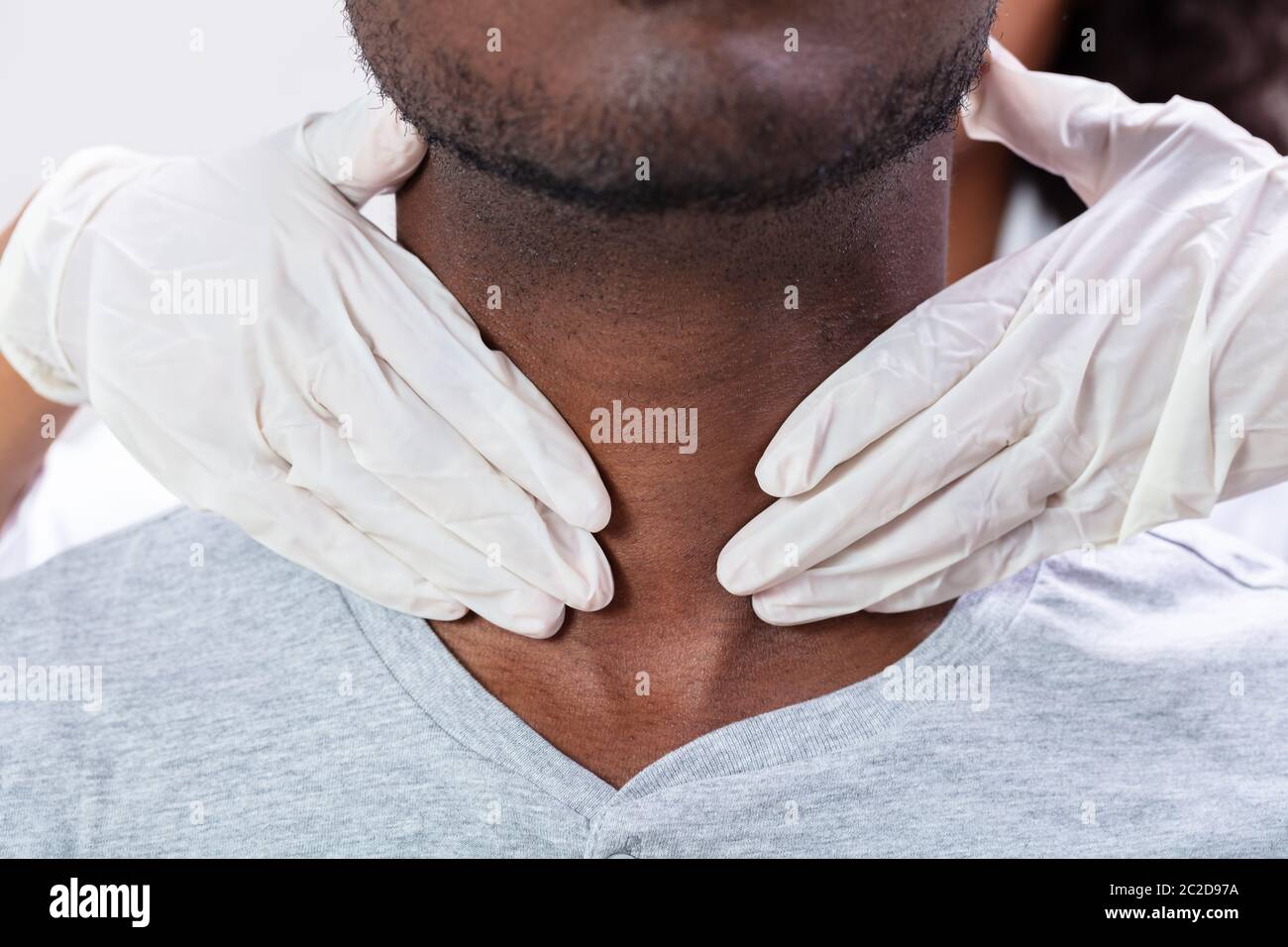 Doctor Performing Physical Exam Palpation Of The Thyroid Gland Stock ...