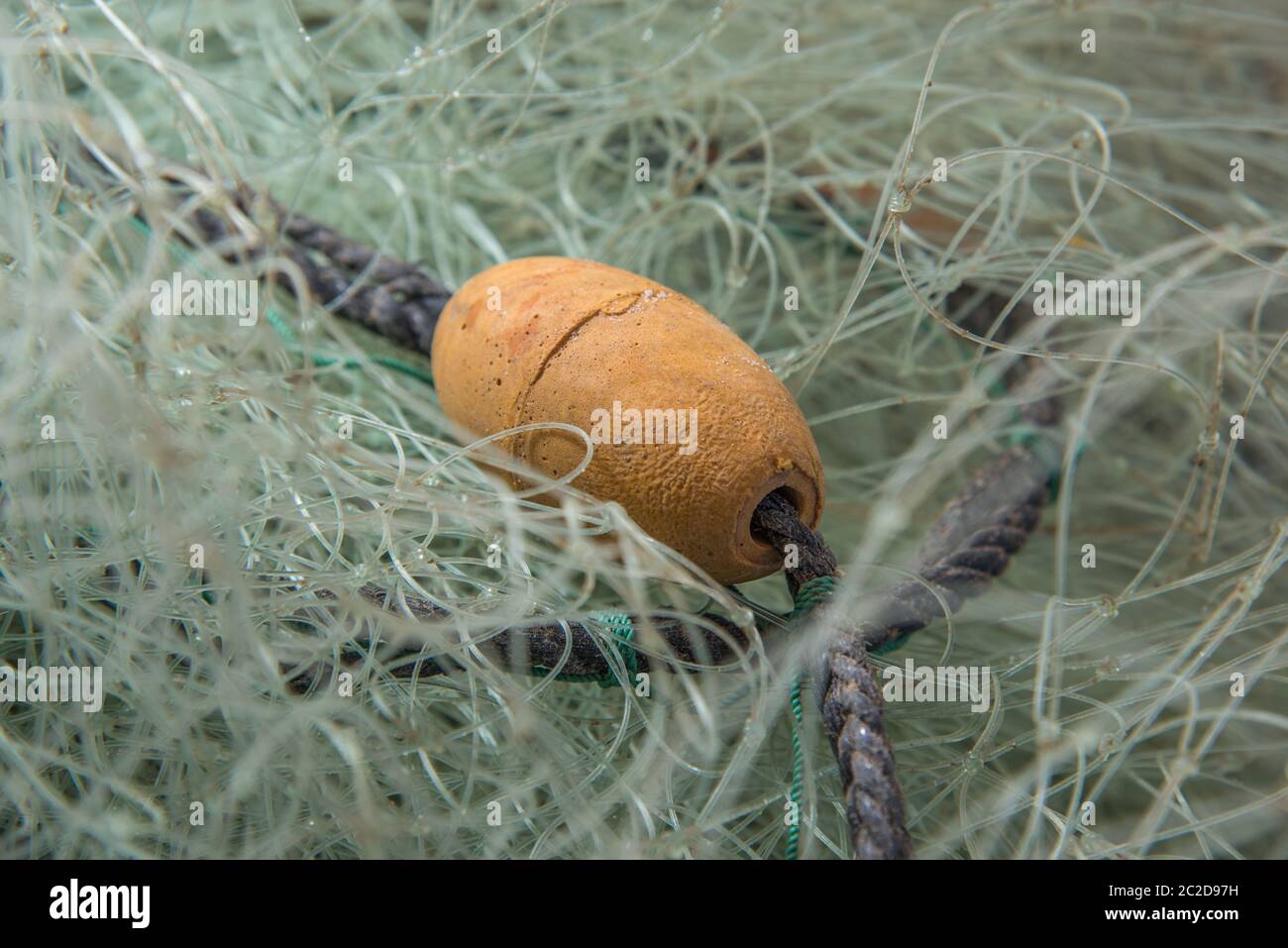 Fishing float with fishing net Stock Photo - Alamy
